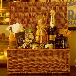 Gift wrapping a luxurious Christmas hamper basket - Jane Means